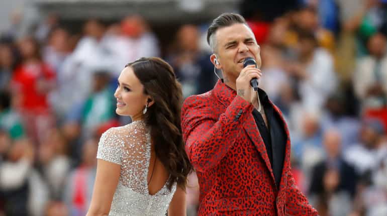 Watch: Robbie Williams gives the finger at World Cup opening ceremony ...
