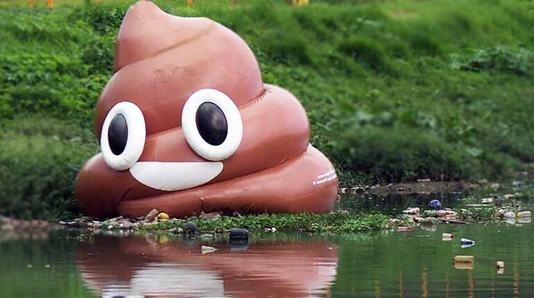Activists in Brazil protest high pollution with giant poo emoji - World ...