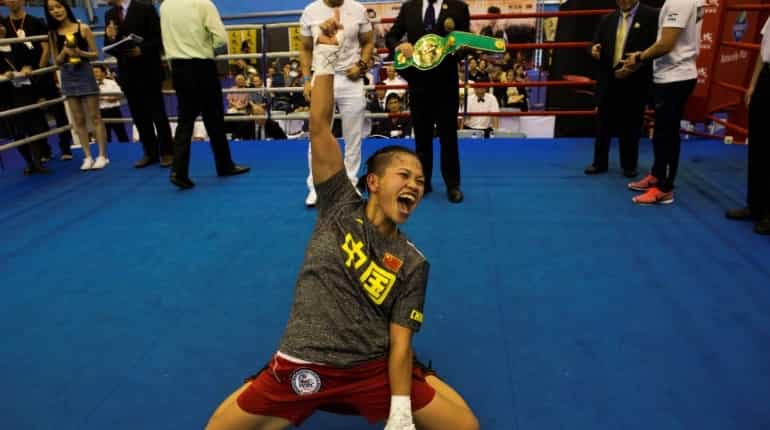 Chinese boxer trounces stereotypes, depression to become 'Queen of the ...