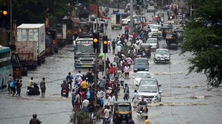 Hundreds stranded at railway station after heavy rains in Mumbai ...