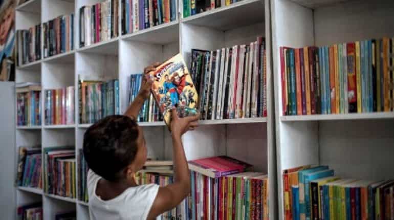 Twelve-year-old bookworm launches favela library in Brazil - World News