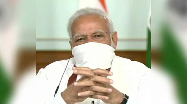 PM Modi dons a homemade face mask during video conference with state ...