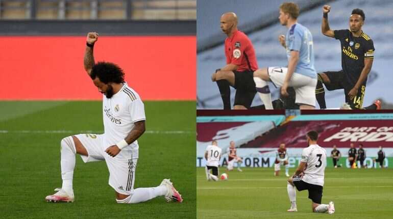 Footballers and teams take a knee during the match support anti-racism ...