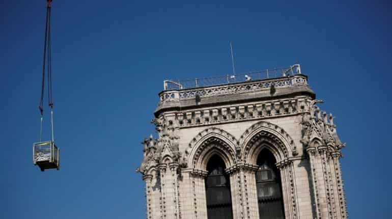 Macron scales Notre-Dame's rooftop two years after cathedral fire ...