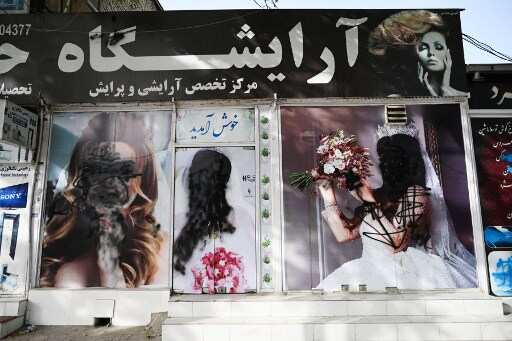 See pics: Women's poster defaced in Kabul as Taliban consolidates hold ...