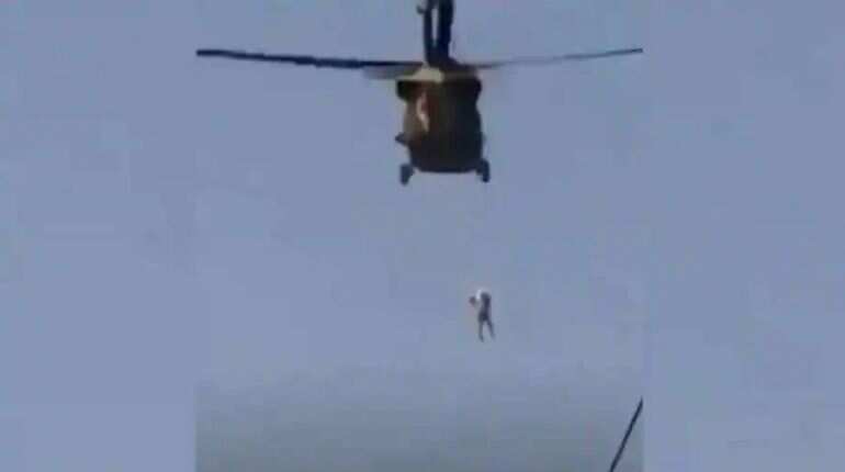 Fact Check: In viral video, man dangling from helicopter was fixing ...