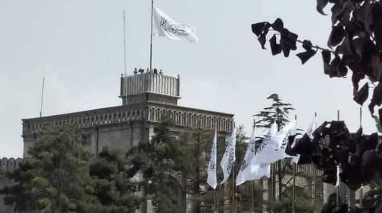 Taliban raise flag on Afghan presidential palace as US marks 9/11 ...