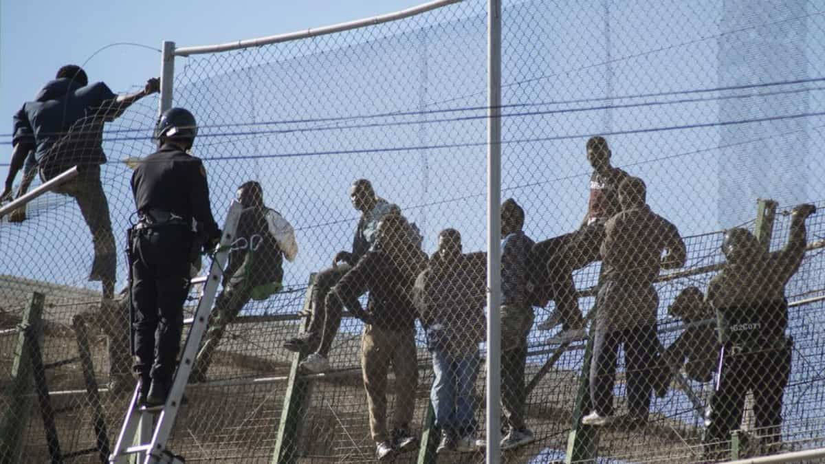 In pics: Over 400 migrants storm border fence in Spain's Melilla ...