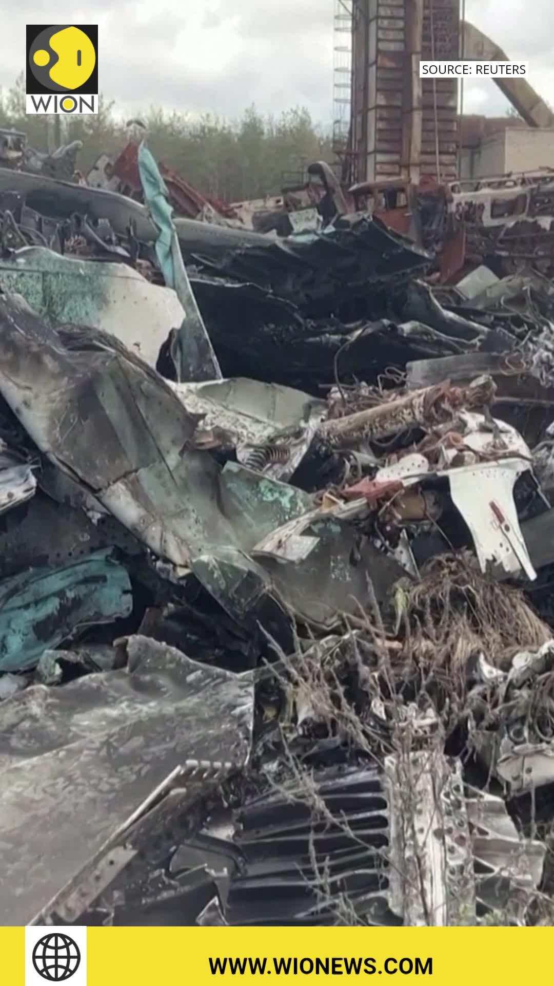 Watch: Abandoned tanks, destruction in Ukraine's recaptured town of ...