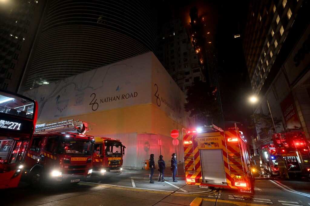 In pics | Massive fire engulfs skyscraper in Hong Kong, scores ...