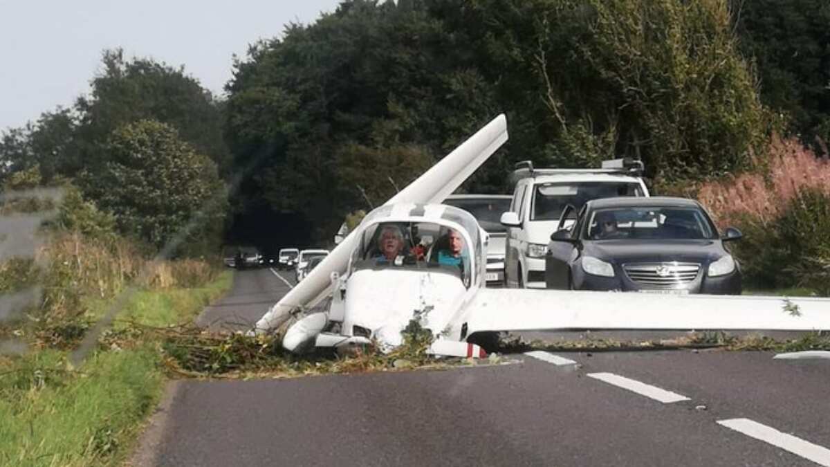 Light aircraft with pilot and passenger crashes on a busy road, but ...