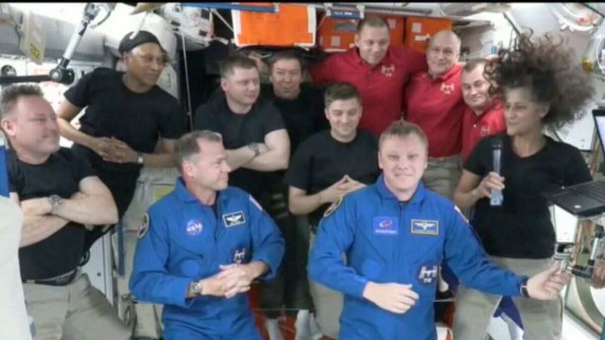Stranded astronauts welcome aboard SpaceX rescue crew at space station ...