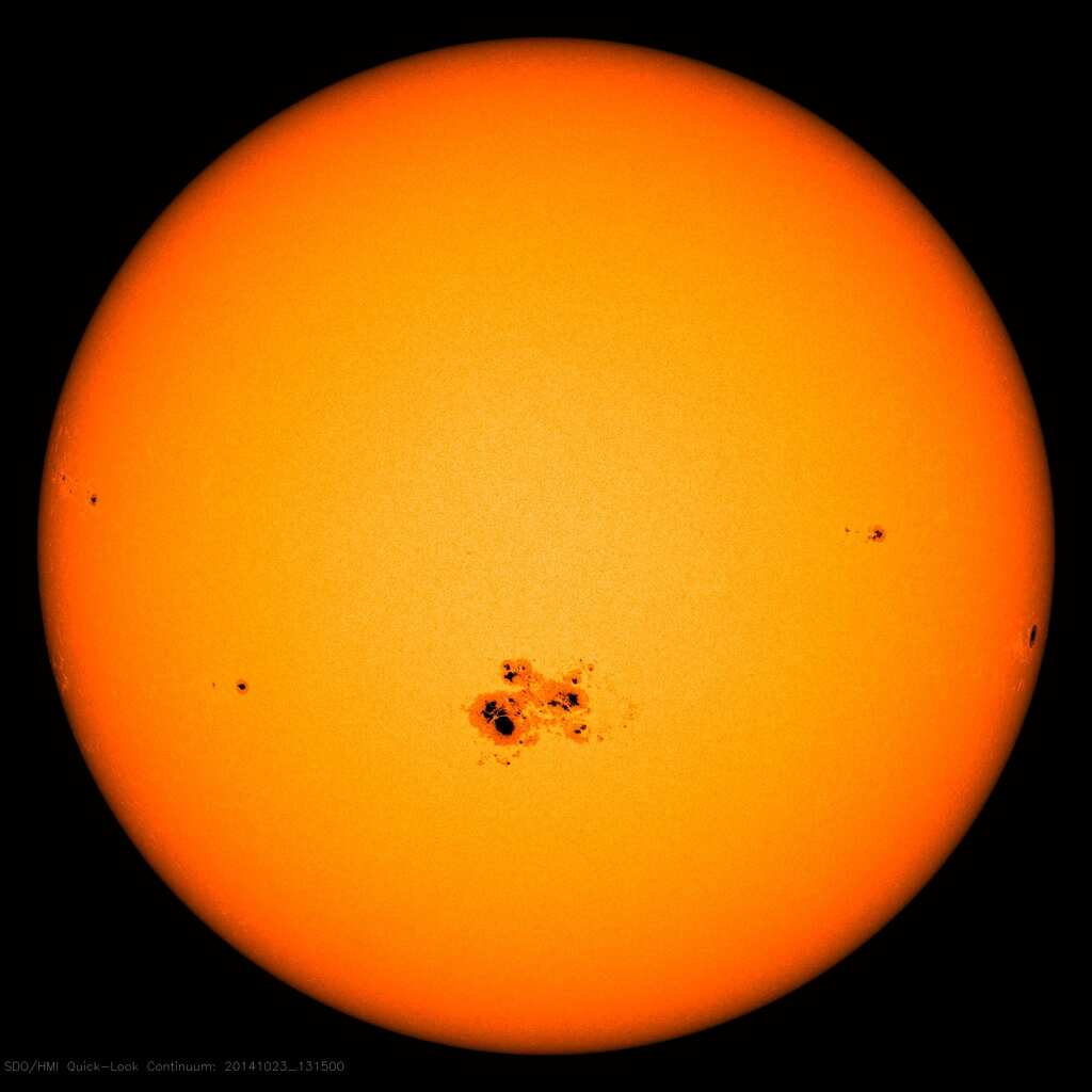 Massive sunspot wider than Earth is now aiming directly at us. Is it ...