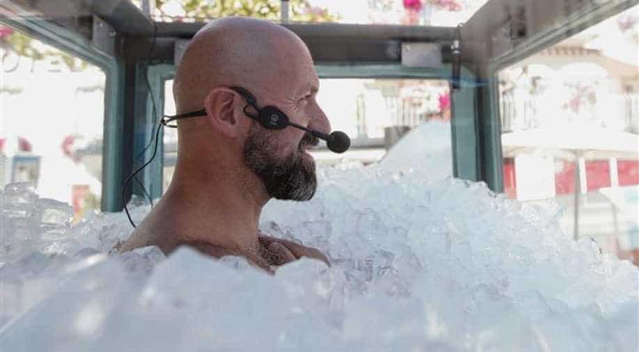 Chilling out: Austrian breaks record for standing in box of ice, World ...