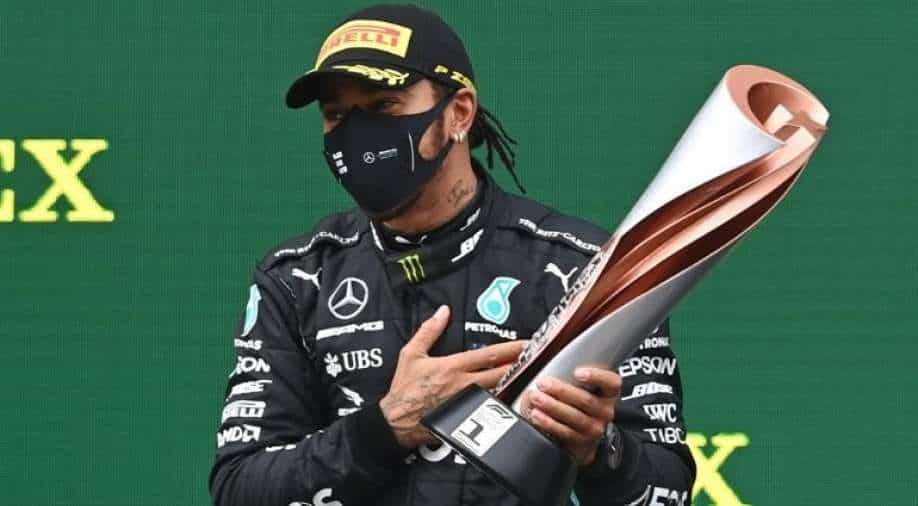 Formula One: Lewis Hamilton wins record-equaling 7th world championship ...