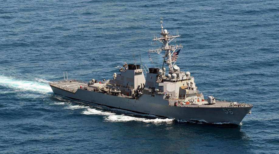 Beijing warns off a US warship sailing near contested islands in South ...
