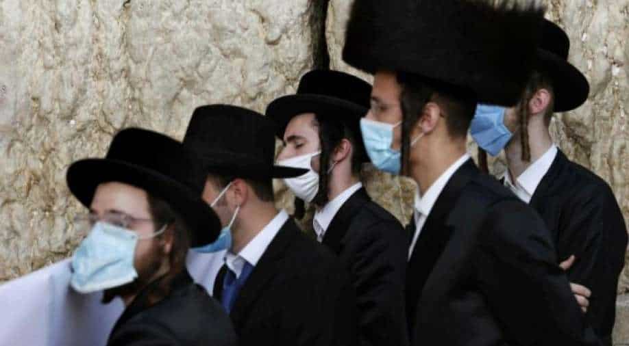 Hundreds of hardline Haredim protest coronavirus enforcement in ...