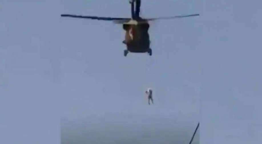Fact Check: In viral video, man dangling from helicopter was fixing ...