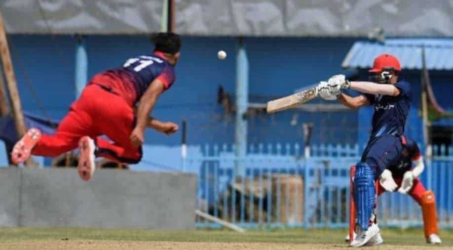 Taliban and Afghan flags side by side as fans enjoy a game of cricket ...