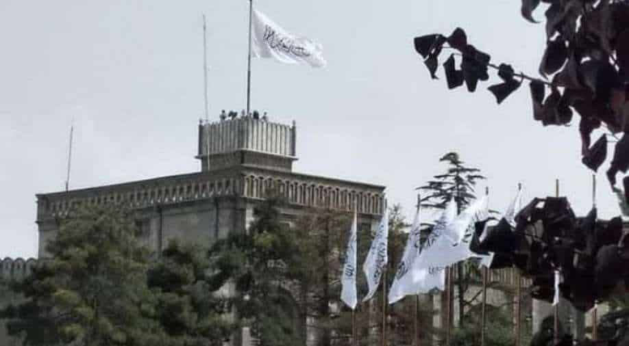 Taliban raise flag on Afghan presidential palace as US marks 9/11 ...