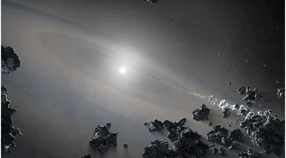 A dead star is ripping apart its planets in 'cosmic cannibalism ...