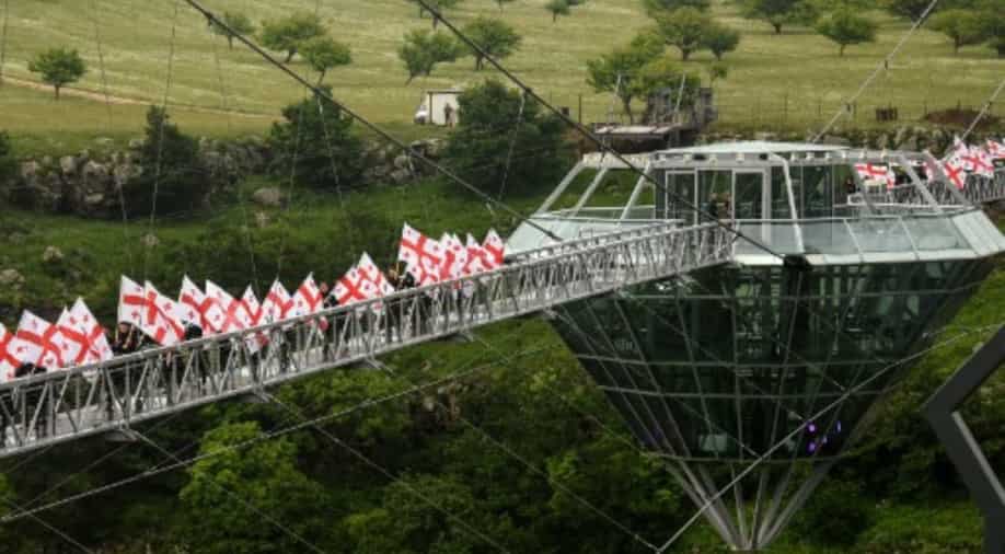 Tourists flock to diamond-shaped 240-meter glass bridge in southern ...