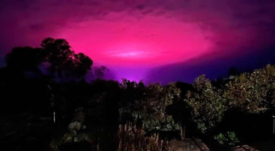 Aliens? Celestial phenomenon? Weed facility? Bizarre pink glow over an ...