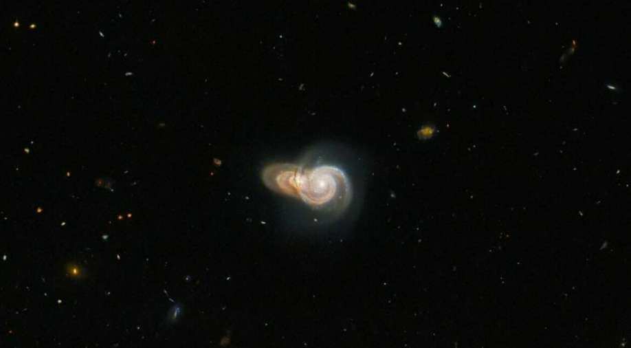 Hubble clicks brilliant photo of two 'overlapping' spiral galaxies ...