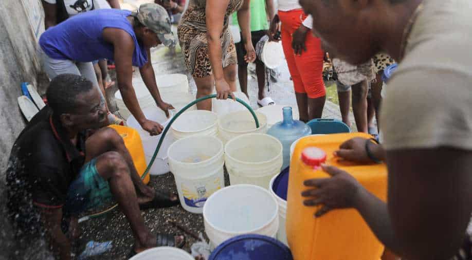 In pics | Thousands of Haitians travel for miles due to water shortage ...