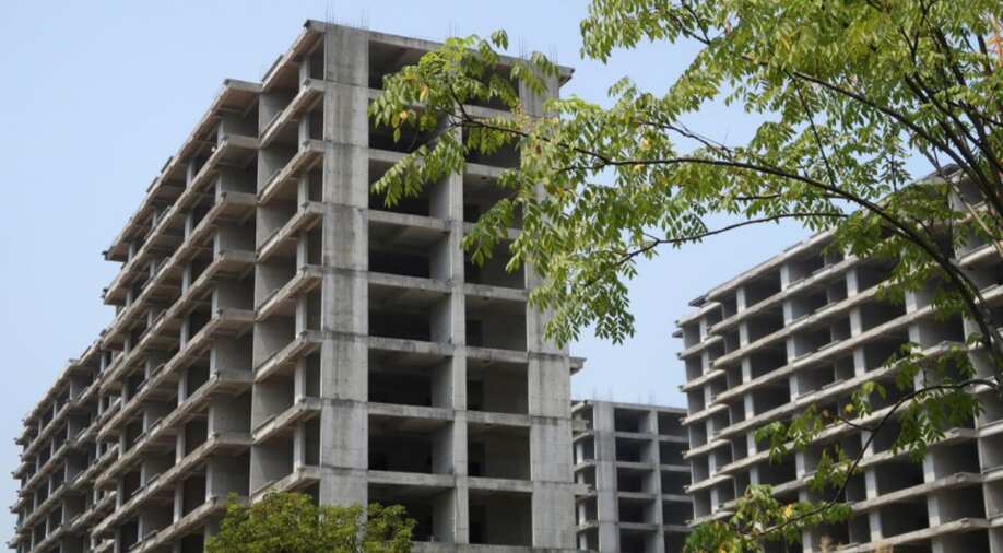 Chinese homeowners forced to live in unfinished, dilapidated apartments ...
