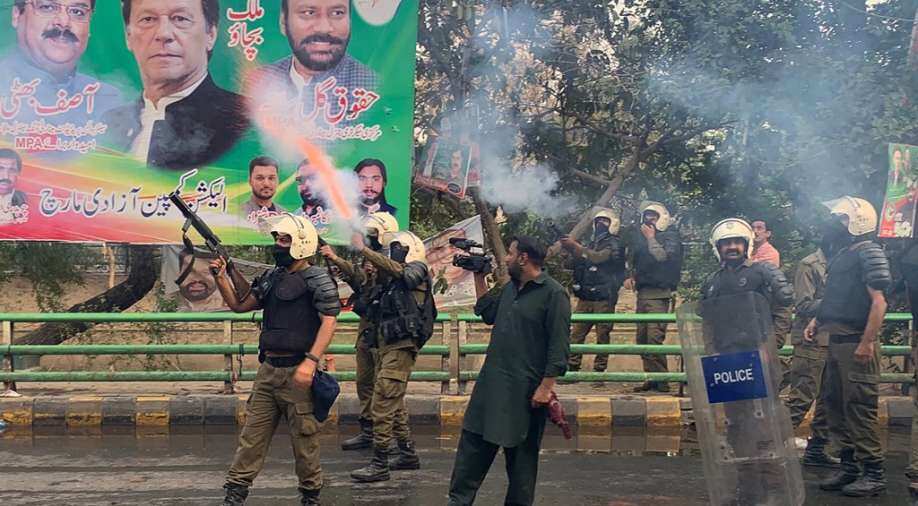 Toshakhana case: Police, PTI workers clash outside ex-PM Imran Khan’s house ahead of possible ...