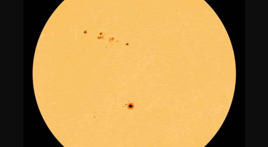 Sunspot four times bigger than earth is visible right now. Here's how ...