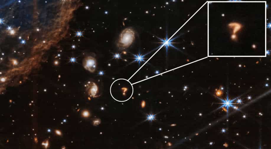 This giant cosmic 'question mark' in space needs answers. What is it ...