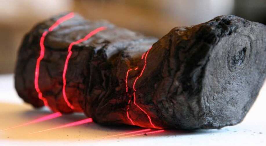 Researchers 'virtually unwrap' ancient scrolls charred by Mt Vesuvius ...