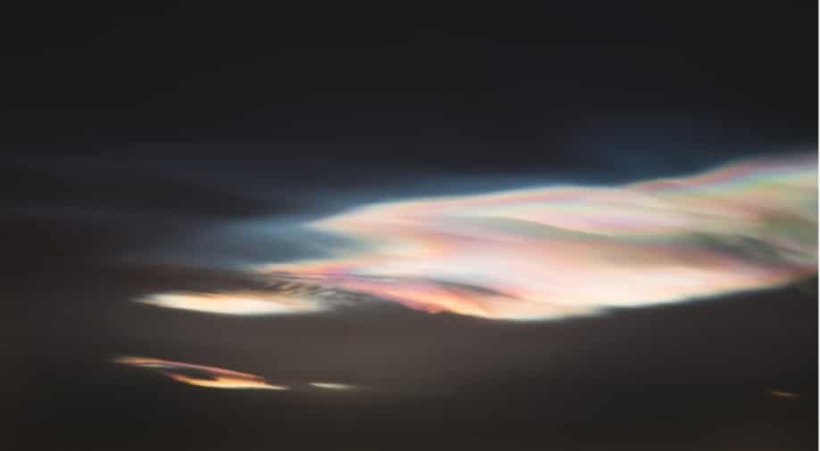 Images show breathtaking rainbow-coloured clouds spreading stunning ...