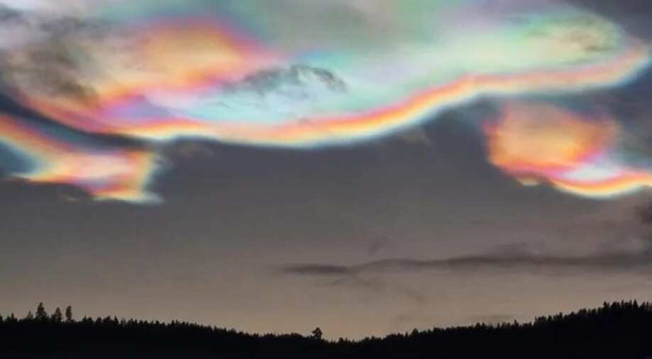 Images show breathtaking rainbow-coloured clouds spreading stunning ...